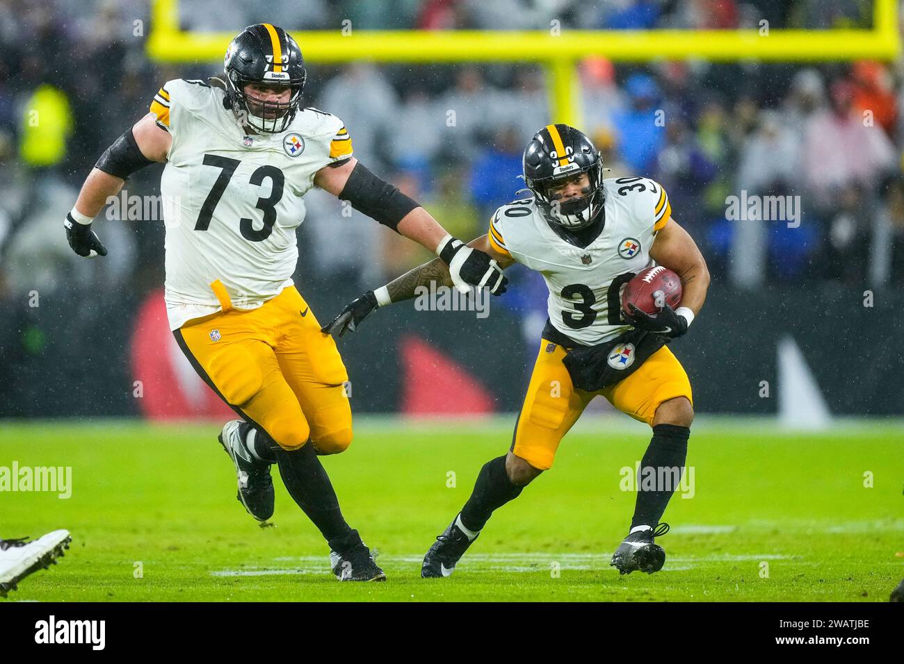 Pittsburgh Steelers running back Jaylen Warren (30) runs with the ball ...
