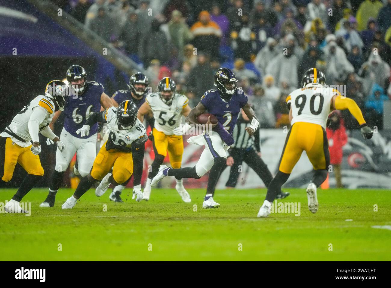 Baltimore Ravens quarterback Tyler Huntley (2) runs with the ball as ...