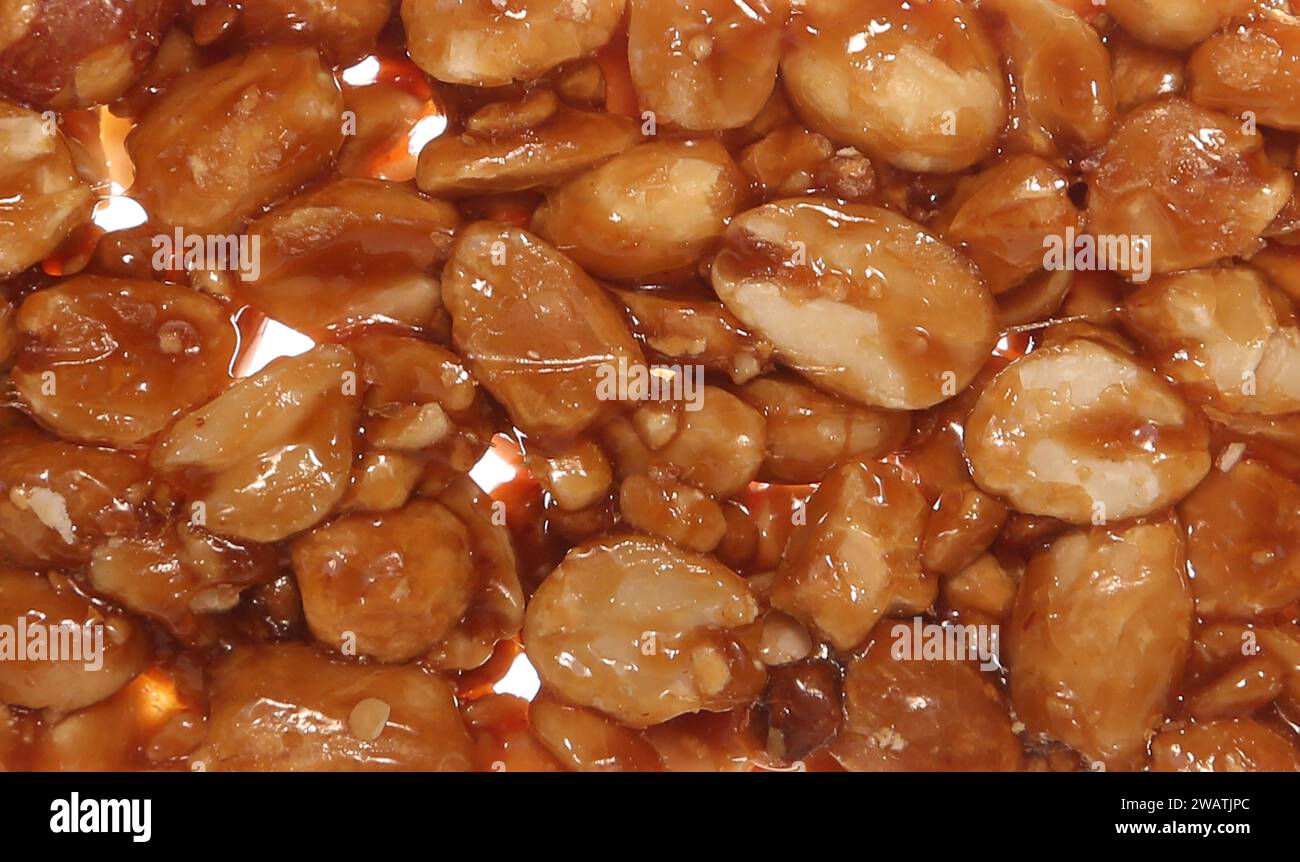 Peanut brittle food abstract background texture Stock Photo - Alamy