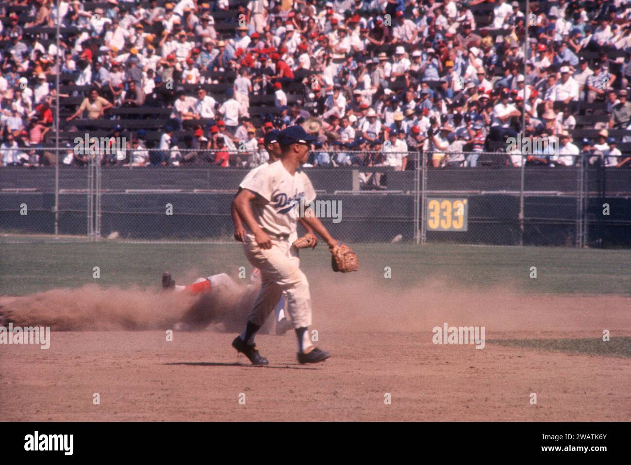 LOS ANGELES, CA - JULY 9: Gene Freese #12 of the Cincinnati Reds slides ...