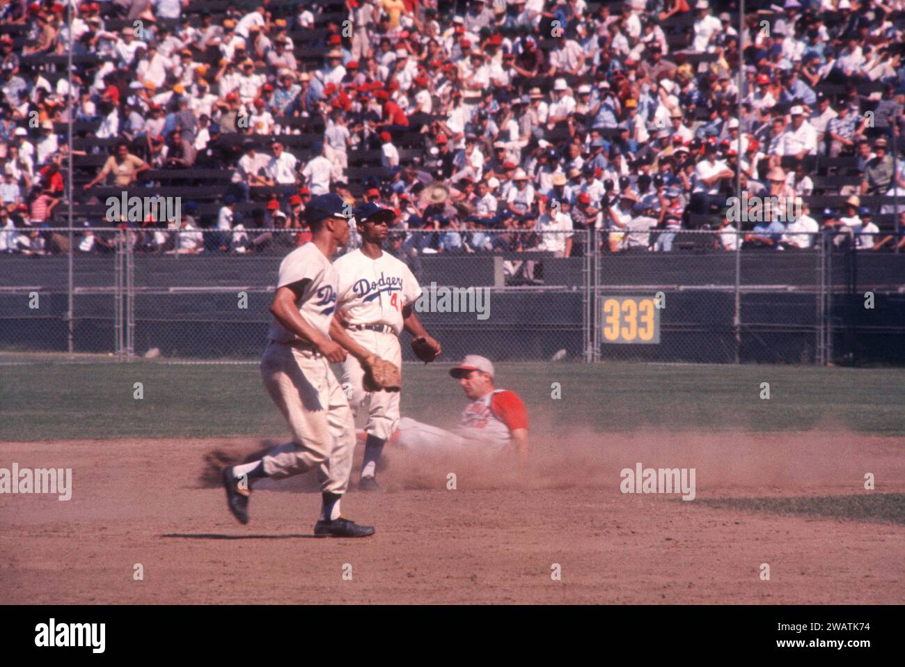 LOS ANGELES, CA - JULY 9: Gene Freese #12 of the Cincinnati Reds slides ...