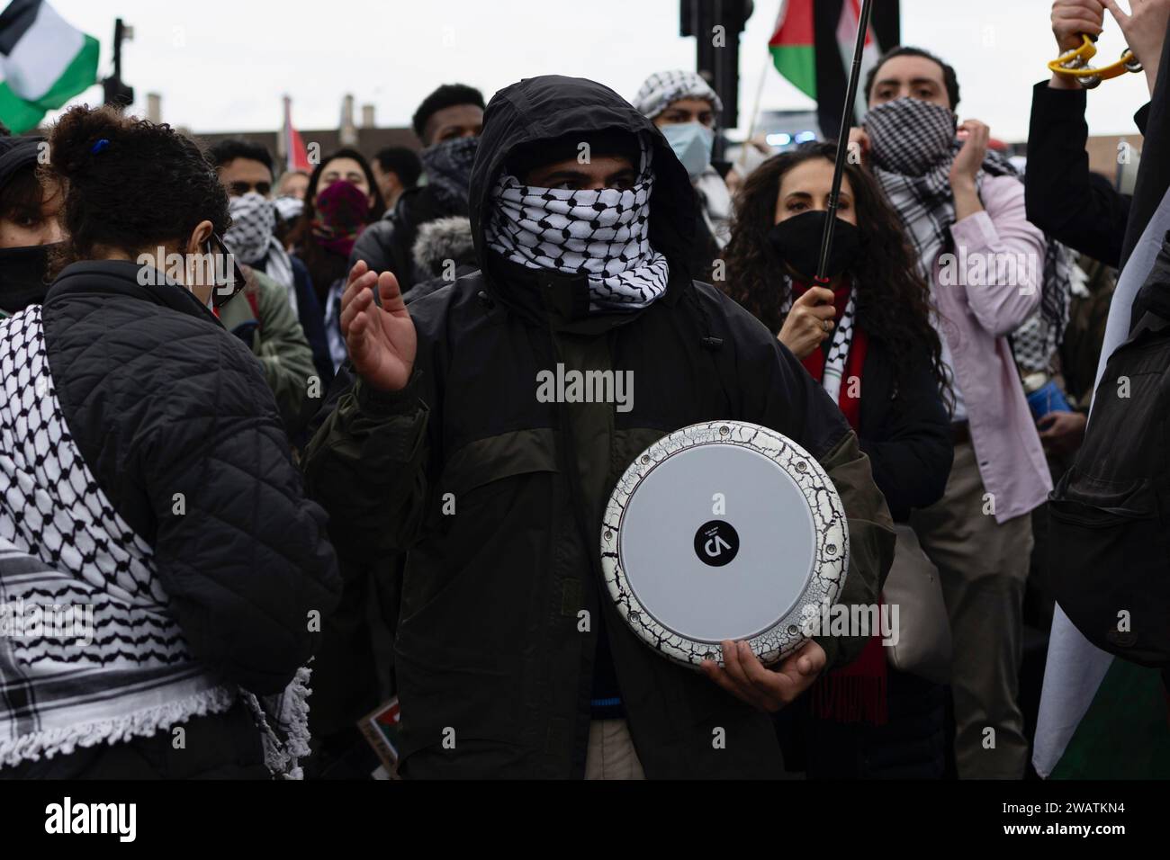 London, UK. 06th Jan, 2024. A protester seen with facial covering ...