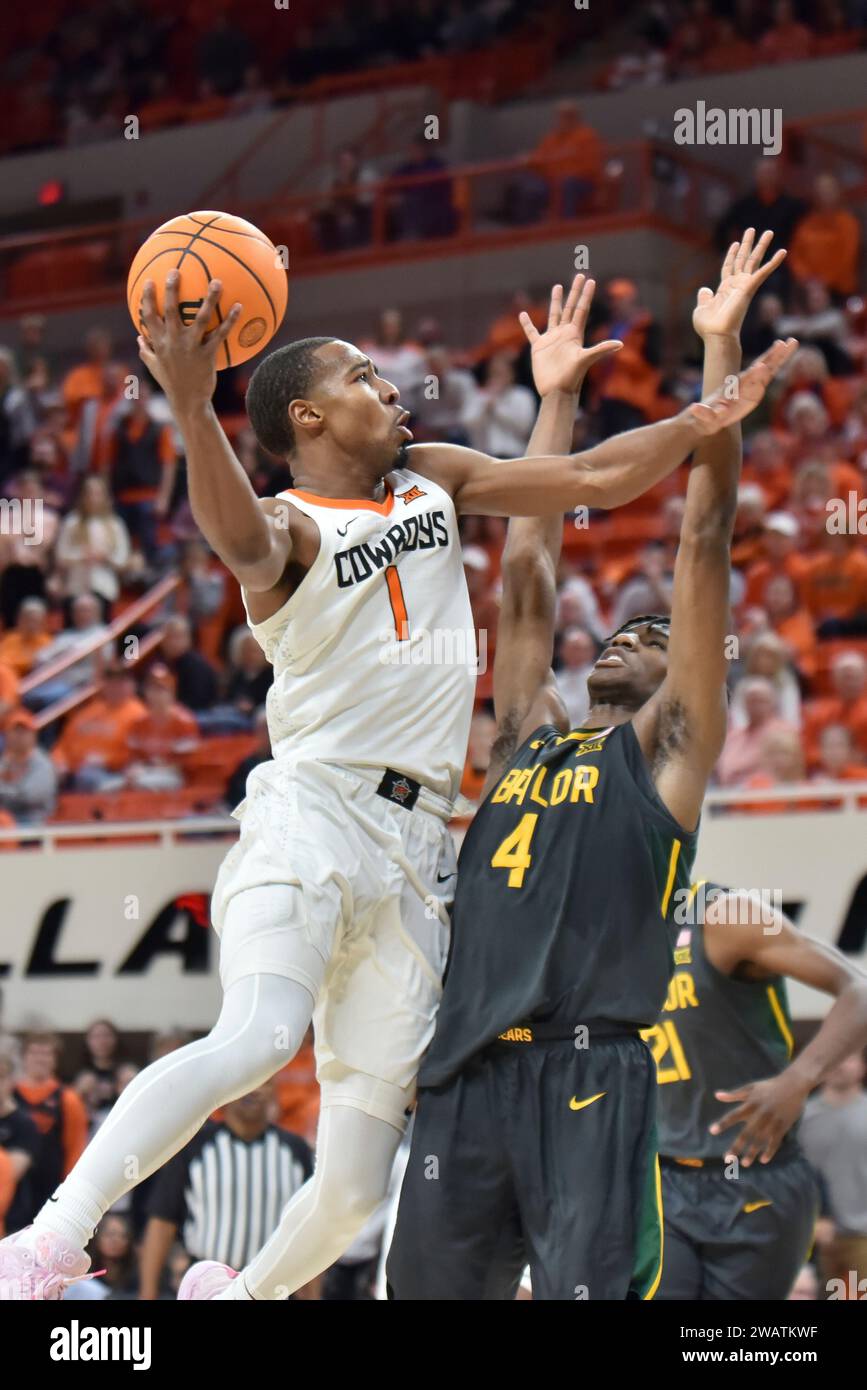 Oklahoma State guard Bryce Thompson (1) goes up to shoot over Baylor ...