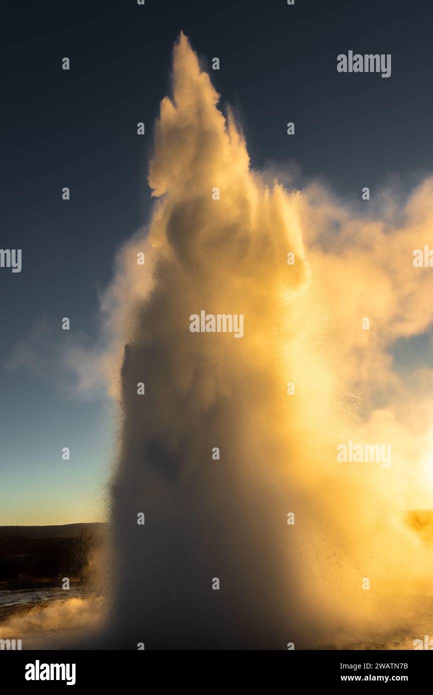 Stokkur geyser spectacular eruption in front of the sun, Iceland Stock ...