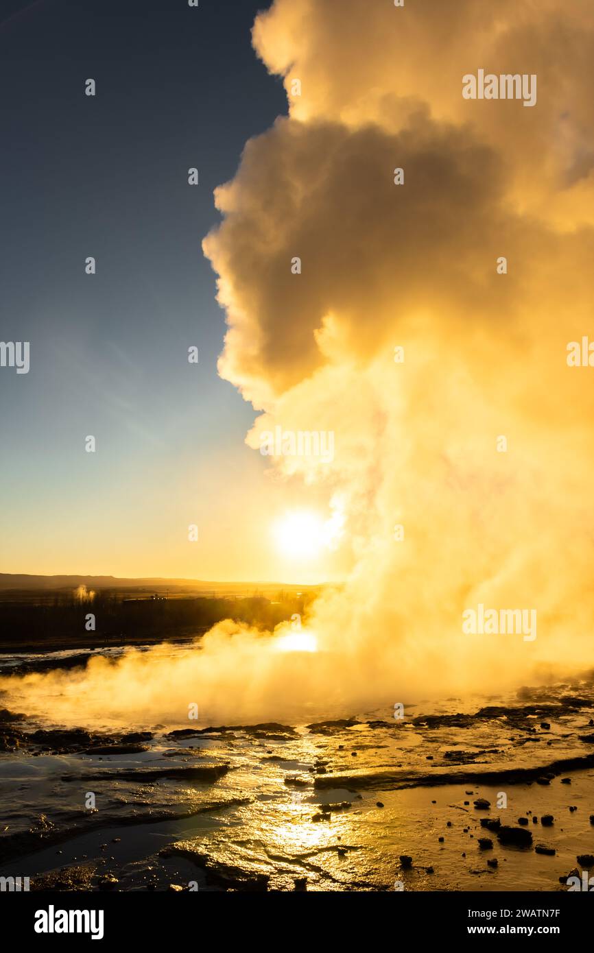 Stokkur geyser spectacular eruption in front of the sun, Iceland Stock ...