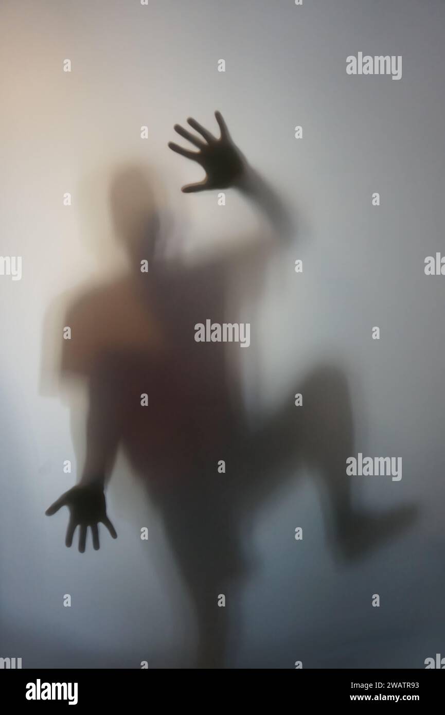 Silhouette man behind frosted glass hi-res stock photography and images ...
