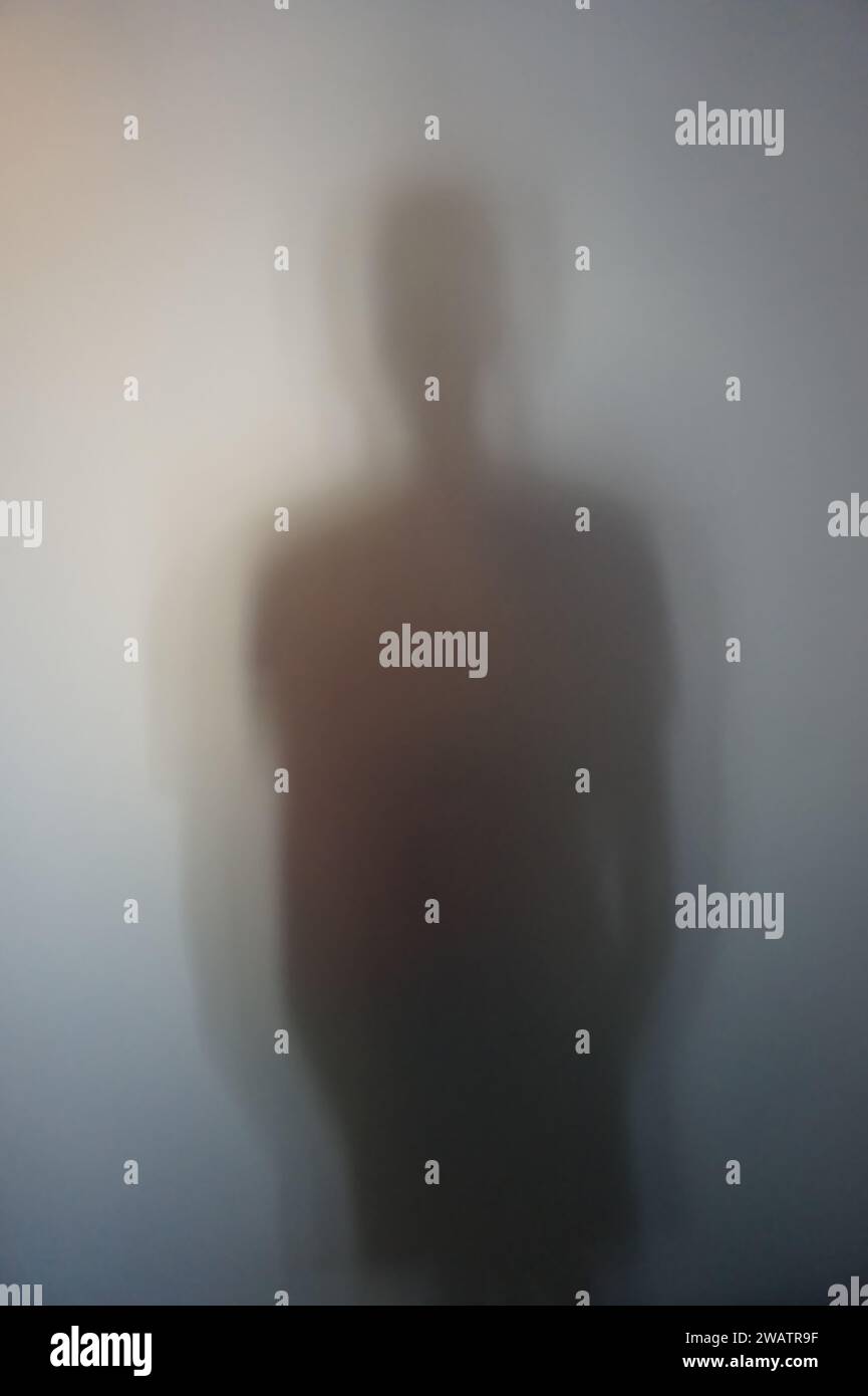 Man silhouette behind frosted glass Stock Photo - Alamy