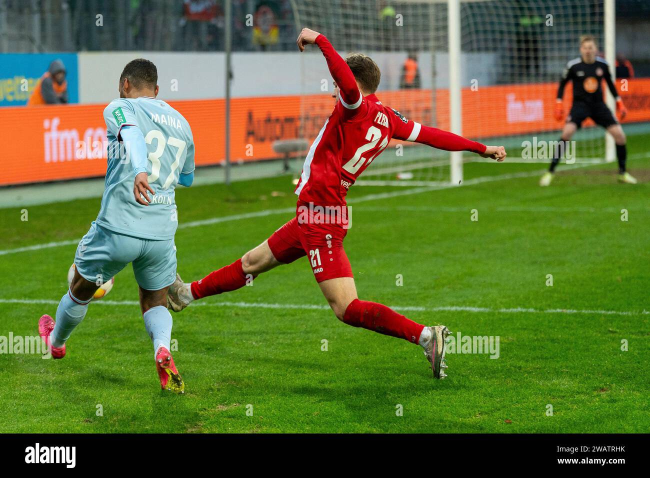 Essen, Deutschland. 06th Jan, 2024. Linton Maina (1. FC Koeln, #37), Sandro Plechaty (Rot-Weiss ...