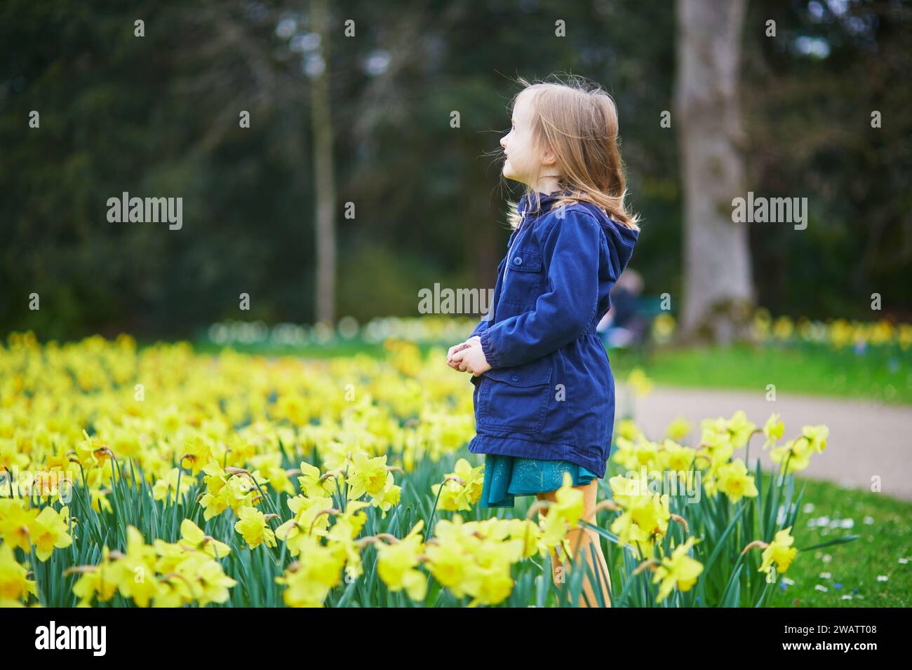 Adorable preschooler girl enjoying nice spring day in park during ...