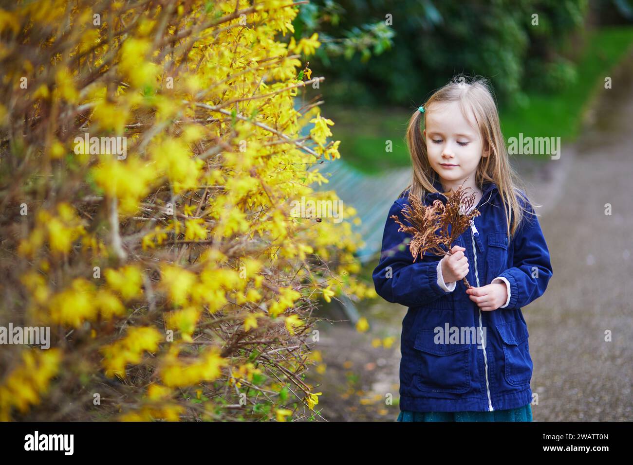 Adorable preschooler girl enjoying nice spring day in park during ...