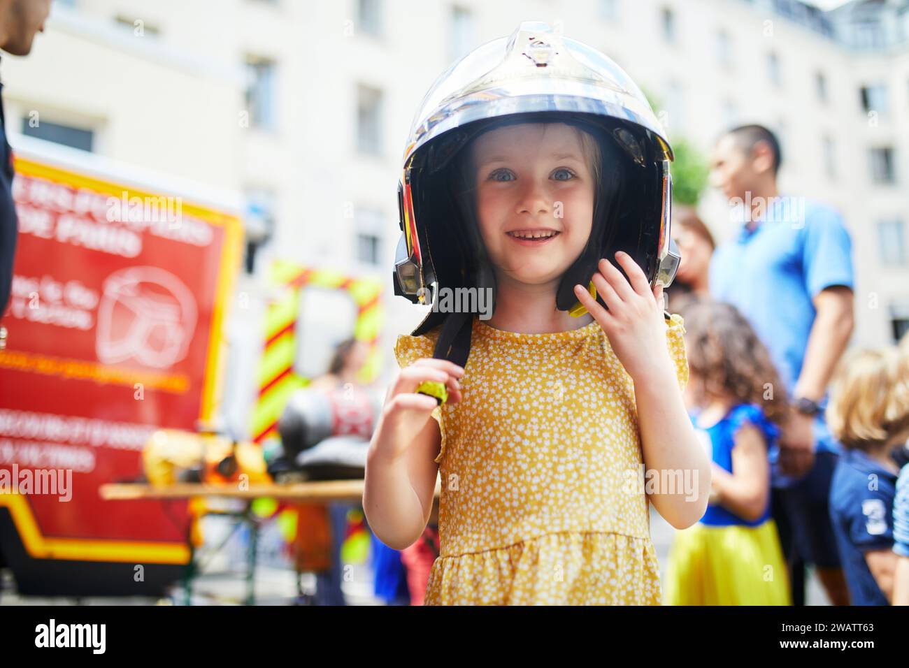 Adorable preschooler girl acting like a fireman and wearing a ...