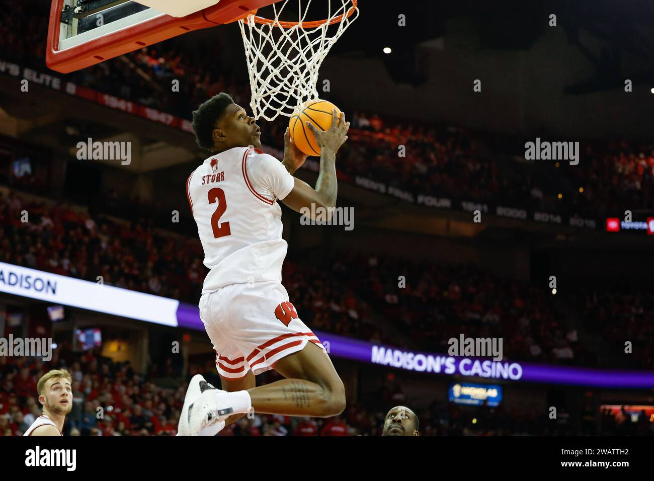 Madison, WI, USA. 6th Jan, 2024. Wisconsin Badgers guard AJ Storr (2) with the reverse layup ...