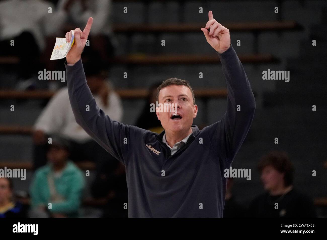 James Madison head coach Mark Byington signals to his team during the ...