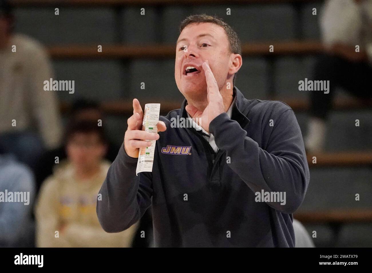 James Madison head coach Mark Byington calls out to his team during the ...