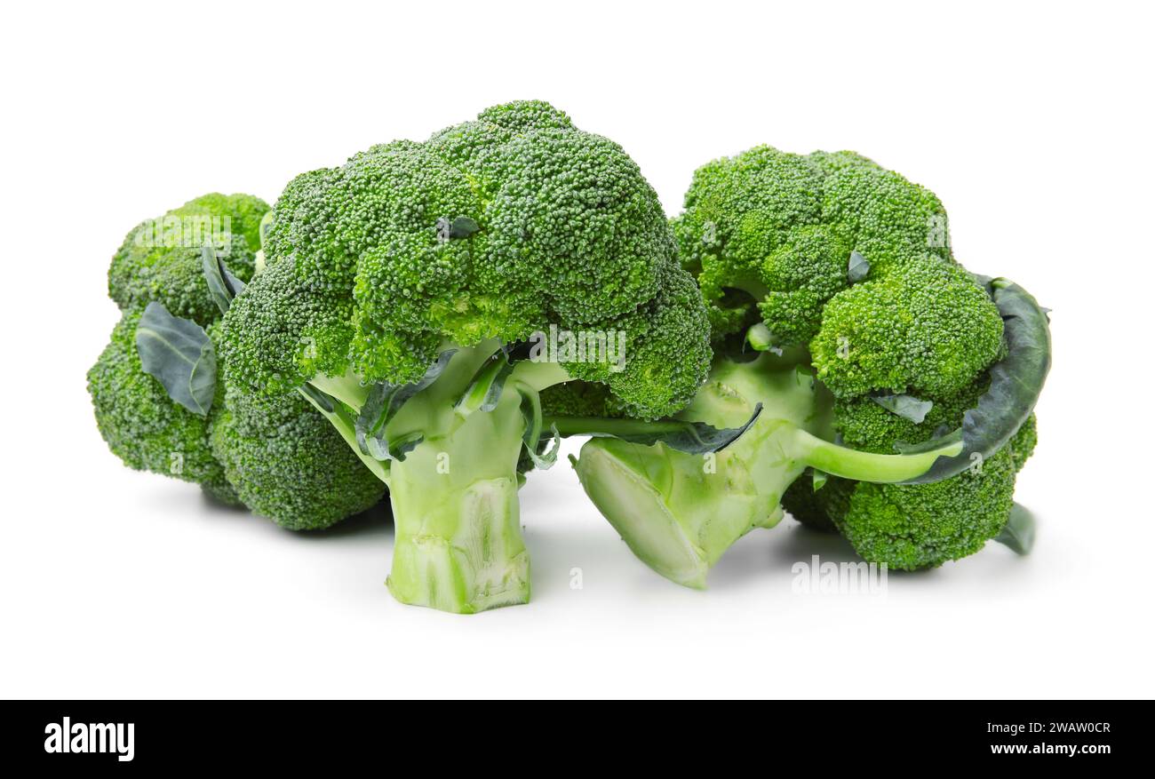 Pile of fresh raw green broccoli isolated on white Stock Photo - Alamy
