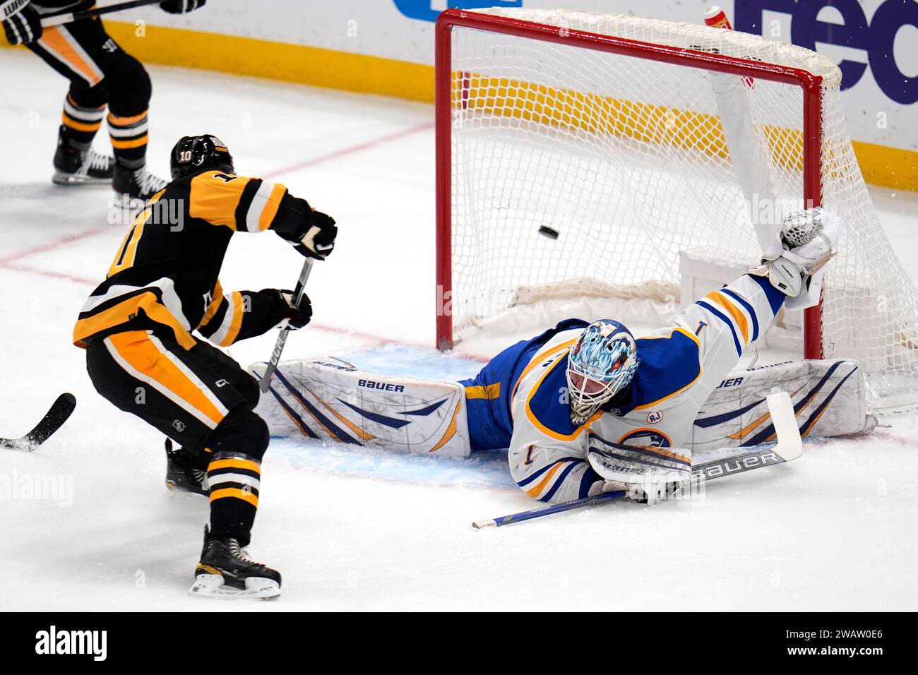 Pittsburgh Penguins' Drew O'Connor (10) gets the puck over Buffalo ...