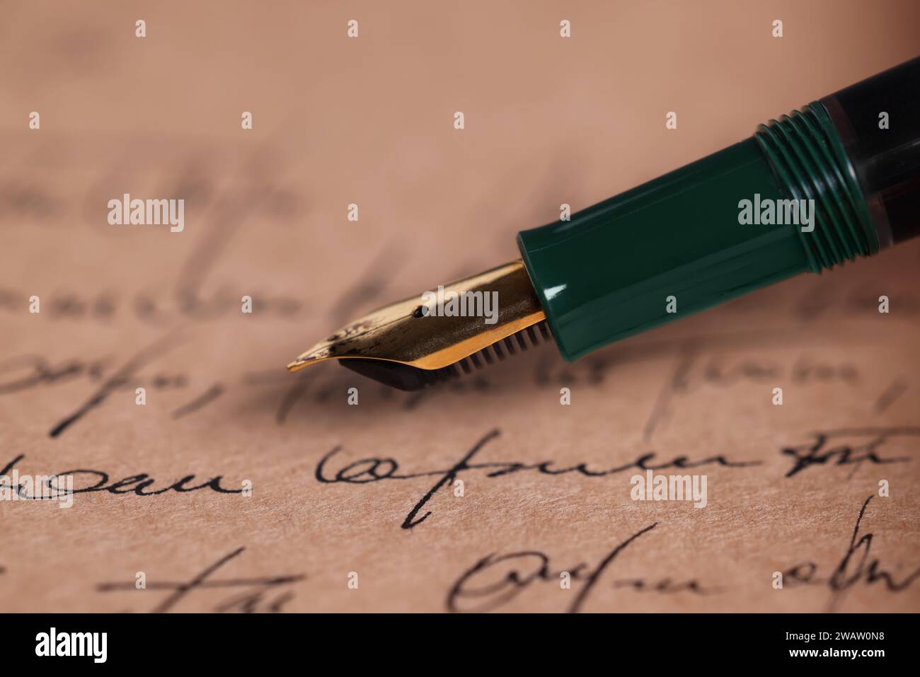Elegant fountain pen on handwritten letter, closeup Stock Photo - Alamy