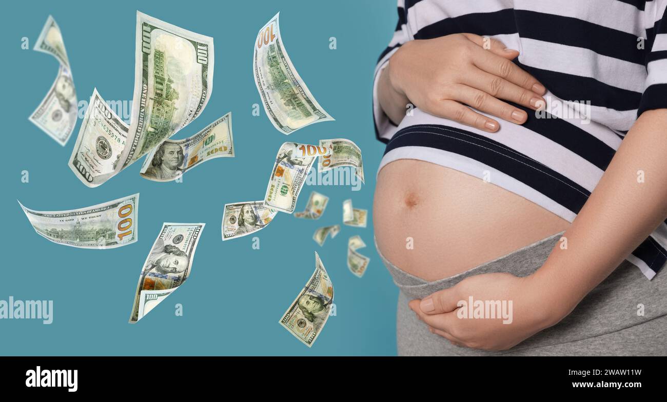 Surrogate mother and flying money on light blue background, closeup ...