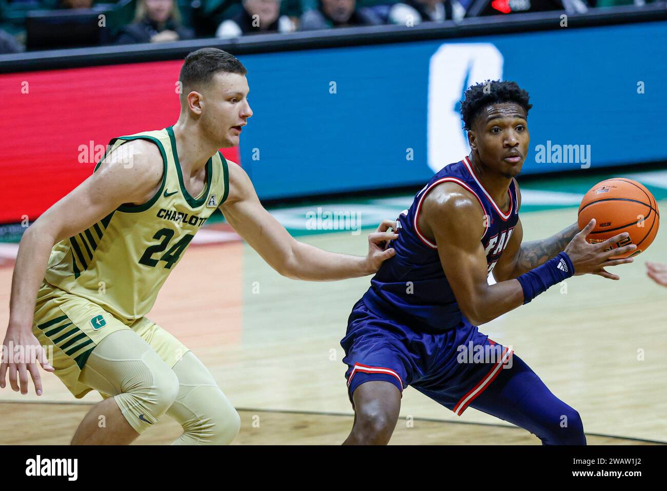 Florida Atlantic guard Brandon Weatherspoon, right, looks to pass ...