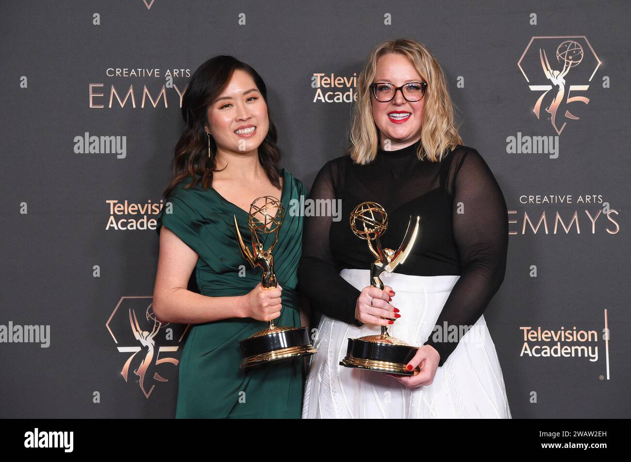 Charlene Lee, left, and Claire Koonce pose in the press room with the award for outstanding ...