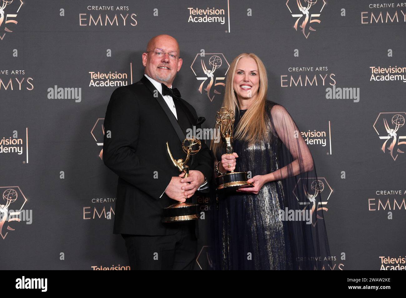 Derek Sullivan, left, and Denise Wingate pose in the press room with the award for outstanding ...