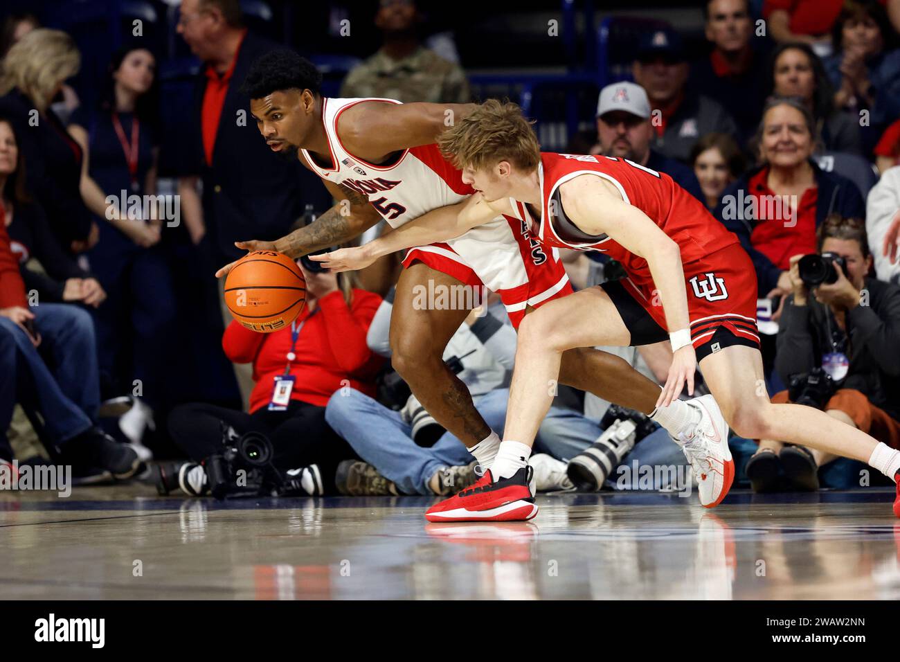 Arizona guard KJ Lewis (5) controls the ball against Utah guard Cole ...