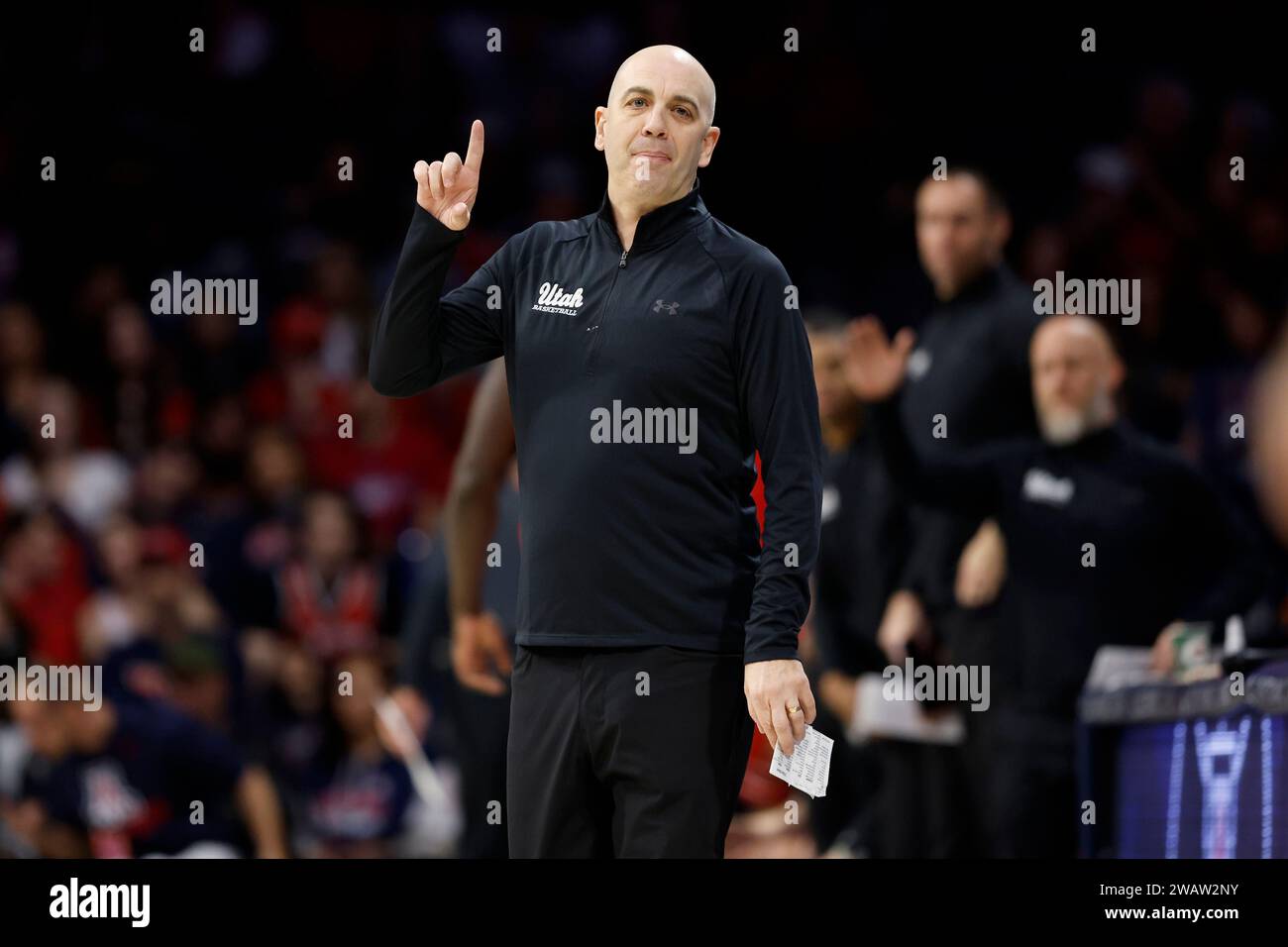 Utah head coach Craig Smith gestures during the first half of an NCAA ...