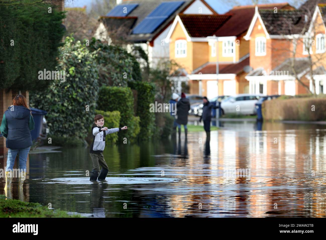 Brampton, UK. 06th Jan, 2024. A youngster enjoys paddling in the flood water in Centenary Way as ...