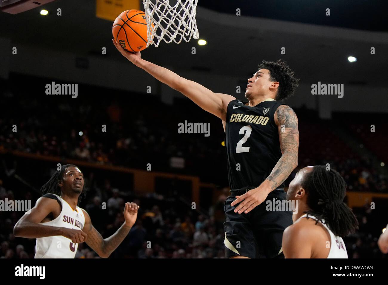 Colorado guard KJ Simpson (2) drives between Arizona State guard Brycen ...