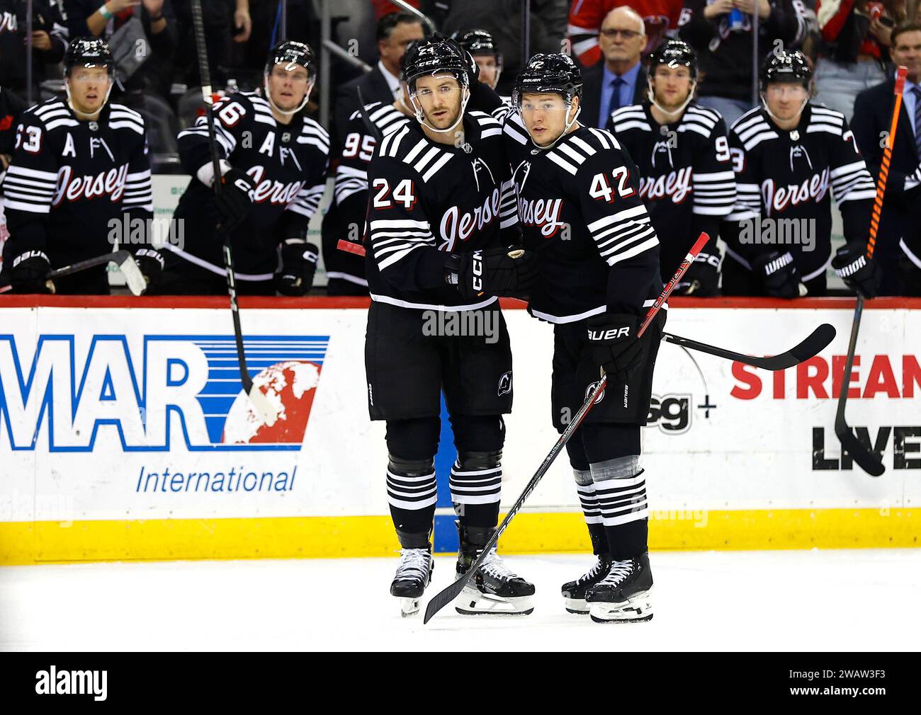New Jersey Devils defenseman Colin Miller (24) celebrates with center ...