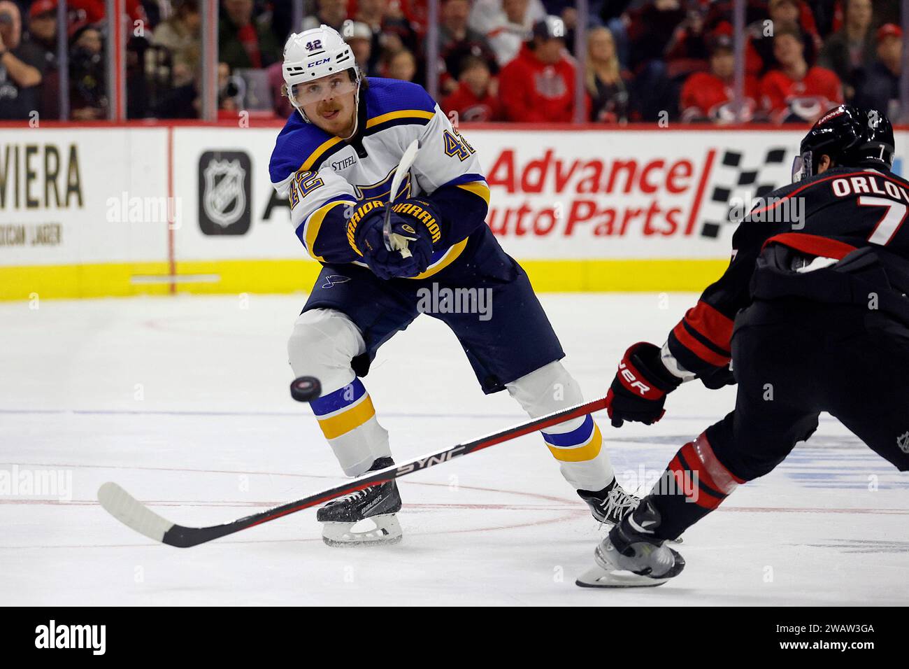 St. Louis Blues' Kasperi Kapanen (42) clears the puck past Carolina ...
