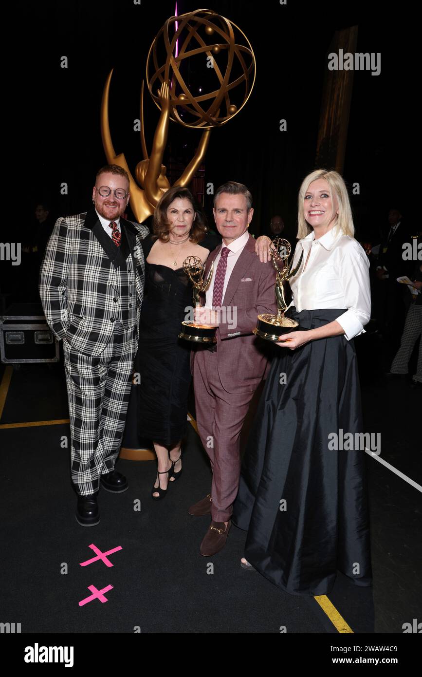 EXCLUSIVE - The team form "Wednesday" pose with the award for ...