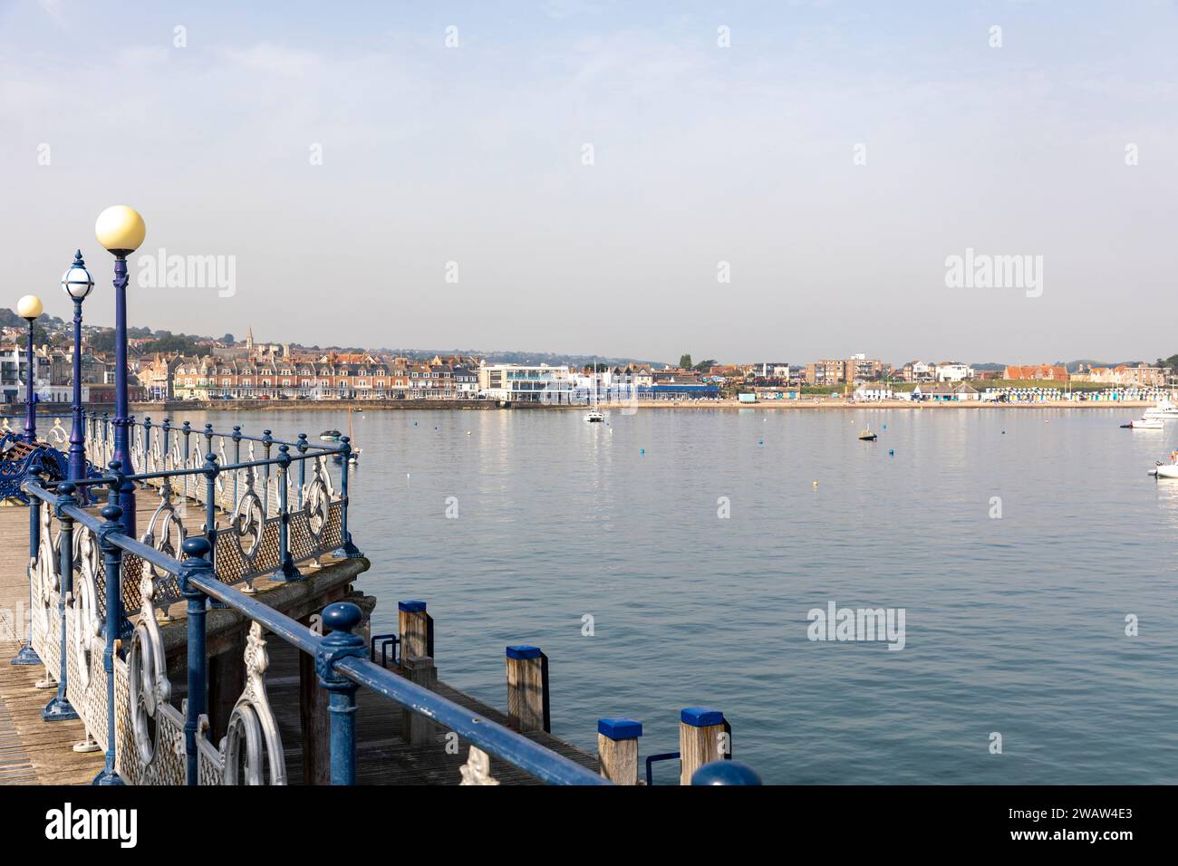 Swanage pier and view across Swanage bay of Swanage town centre, sunny ...