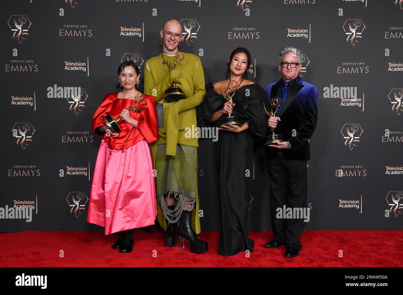 Helen Huang, from left, Austin Wittick, YJ Hwang, and Mark Summers pose in the press room with ...