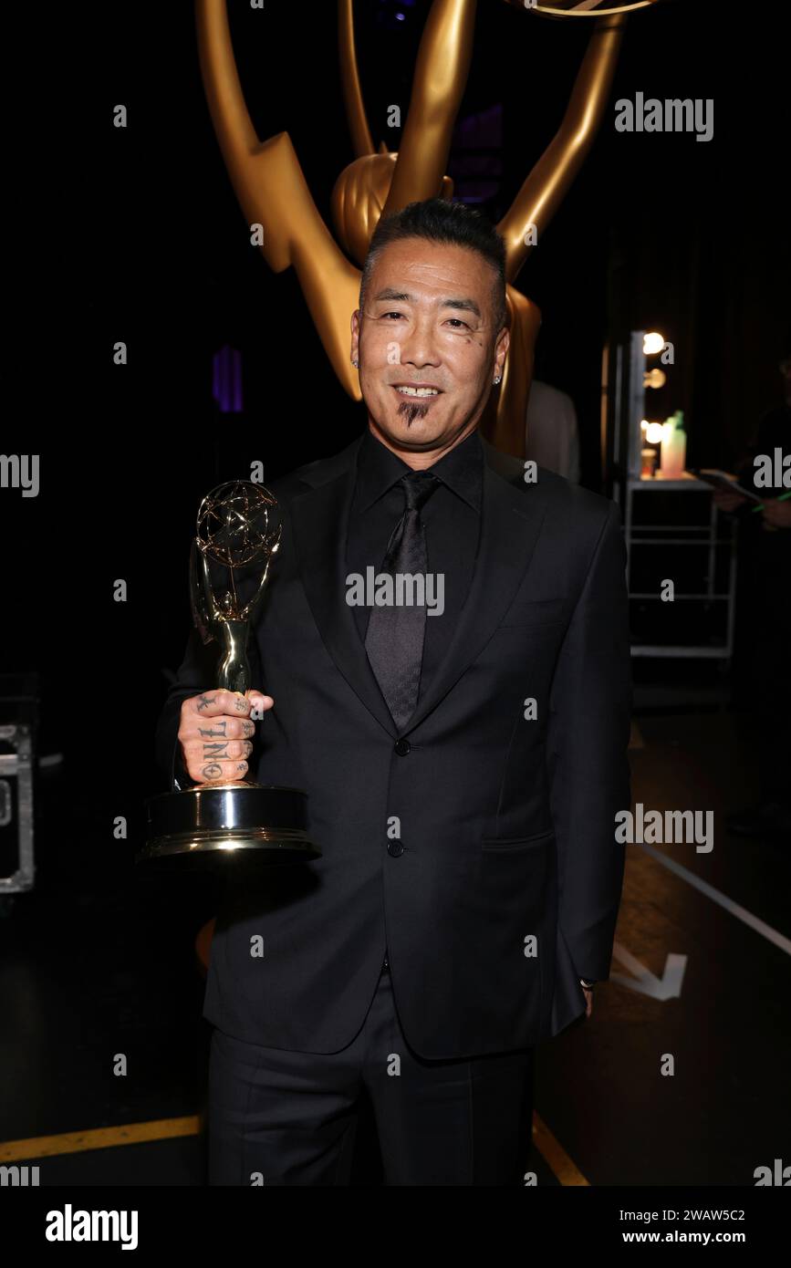 EXCLUSIVE - John Koyama poses with the award for outstanding stunt ...
