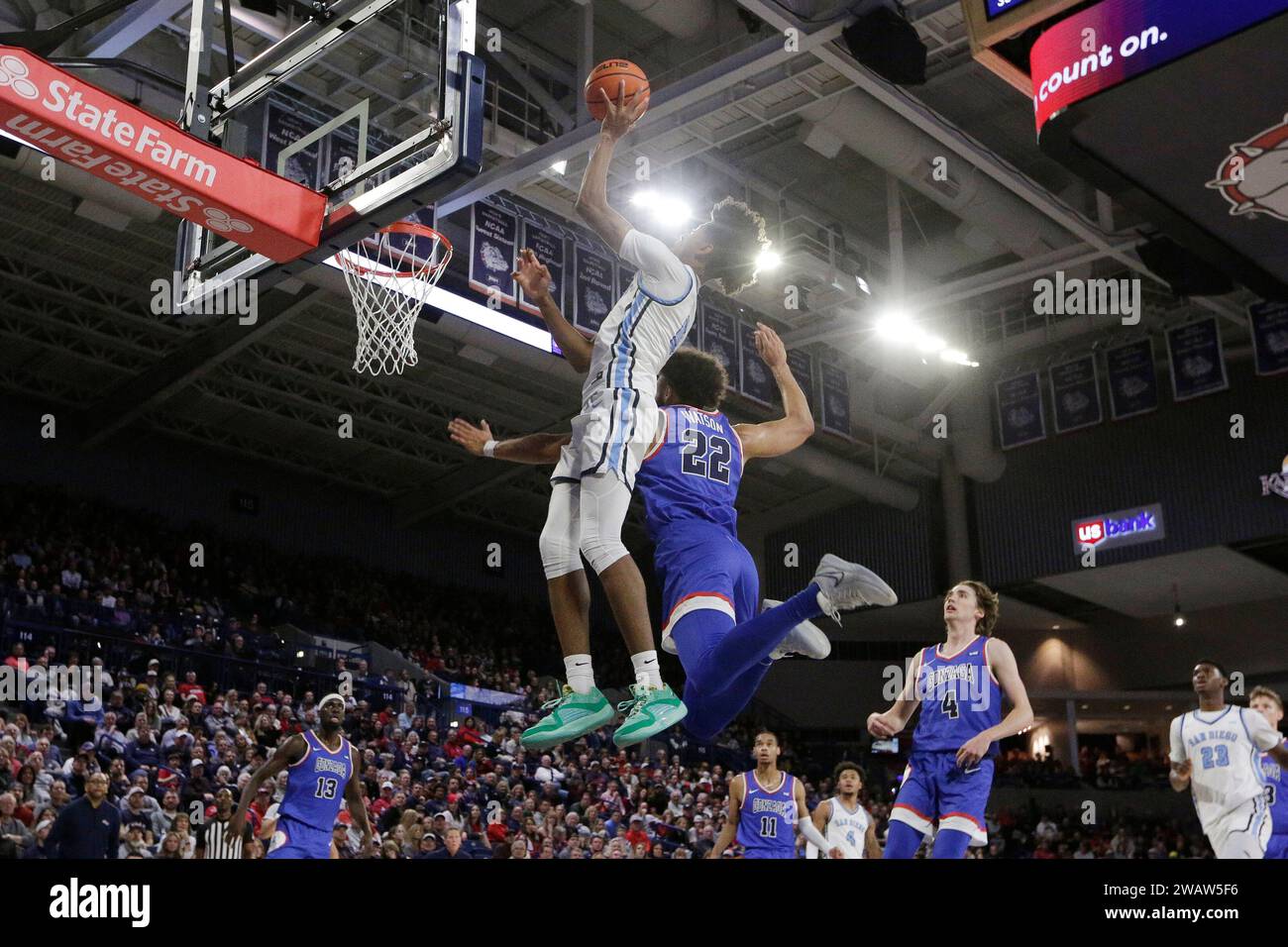San Diego guard Kevin Patton Jr., front left, shoots while pressured by ...