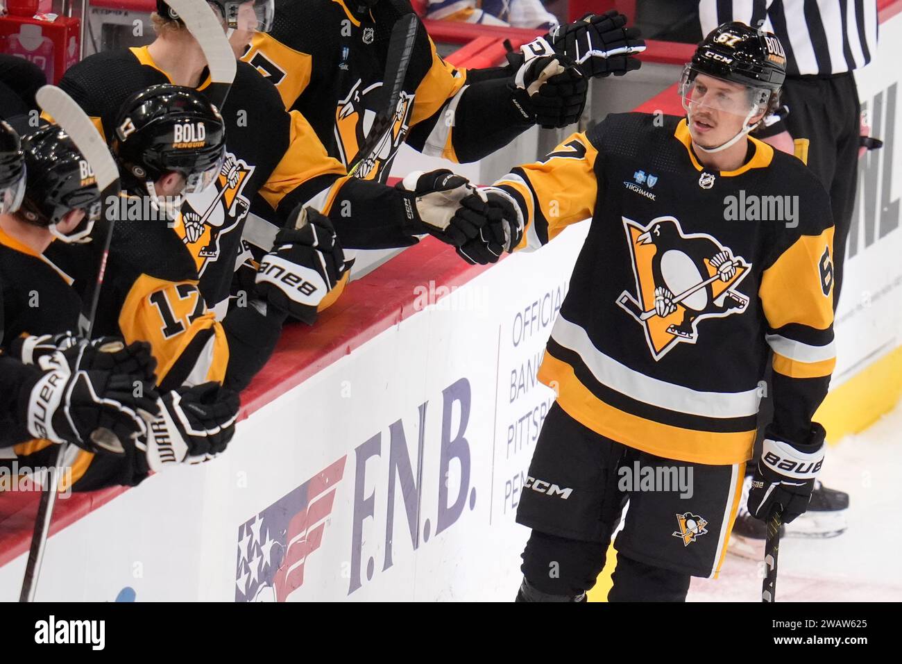 Pittsburgh Penguins' Rickard Rakell (67) is congratulated for his goal ...