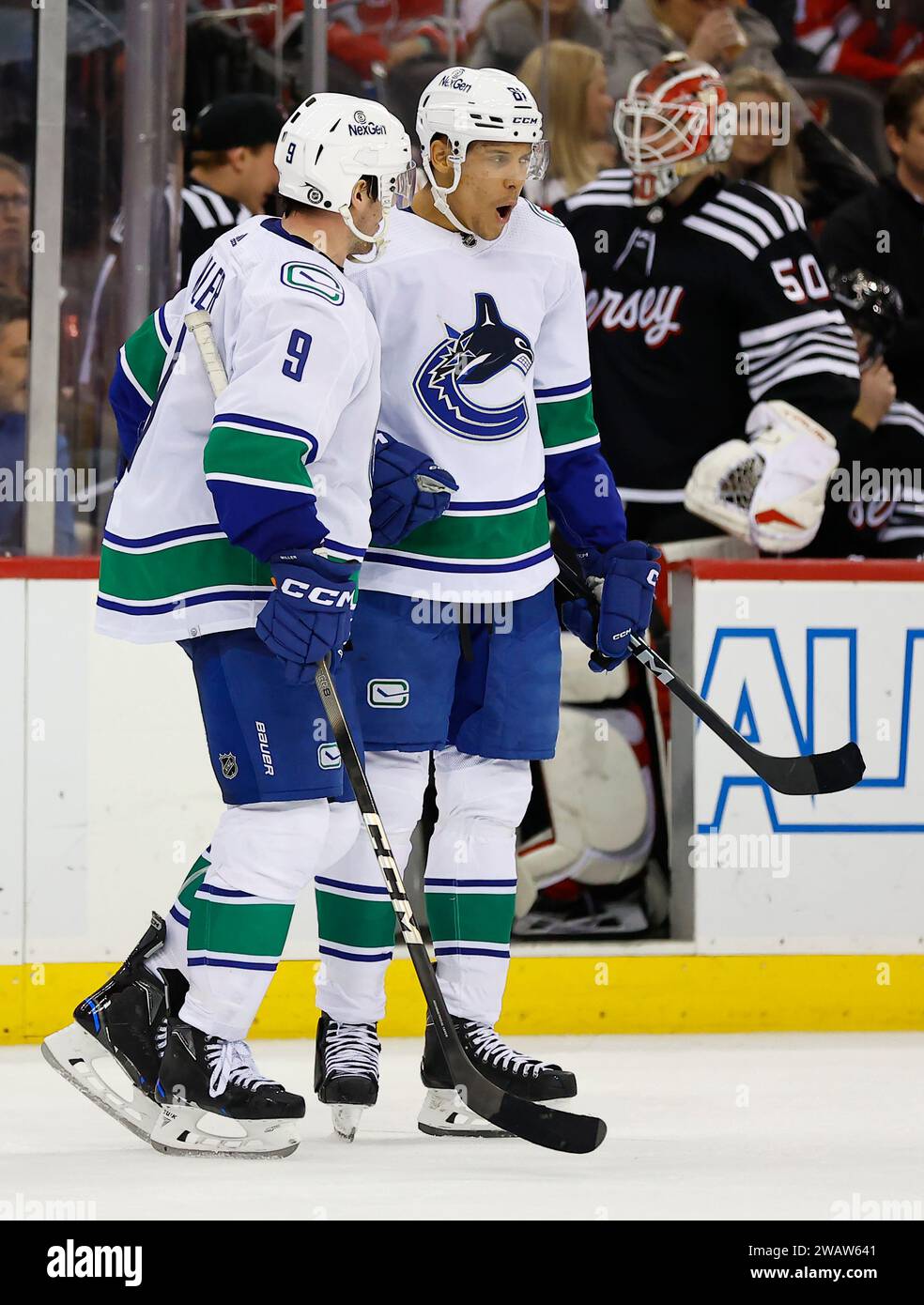 New Jersey Devils goaltender Nico Daws (50) looks on as Vancouver ...