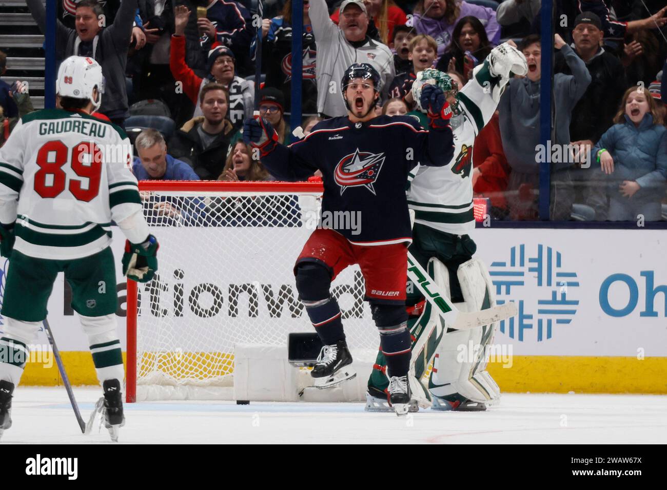 Columbus Blue Jackets' Cole Sillinger, front, celebrates his hat-trick ...