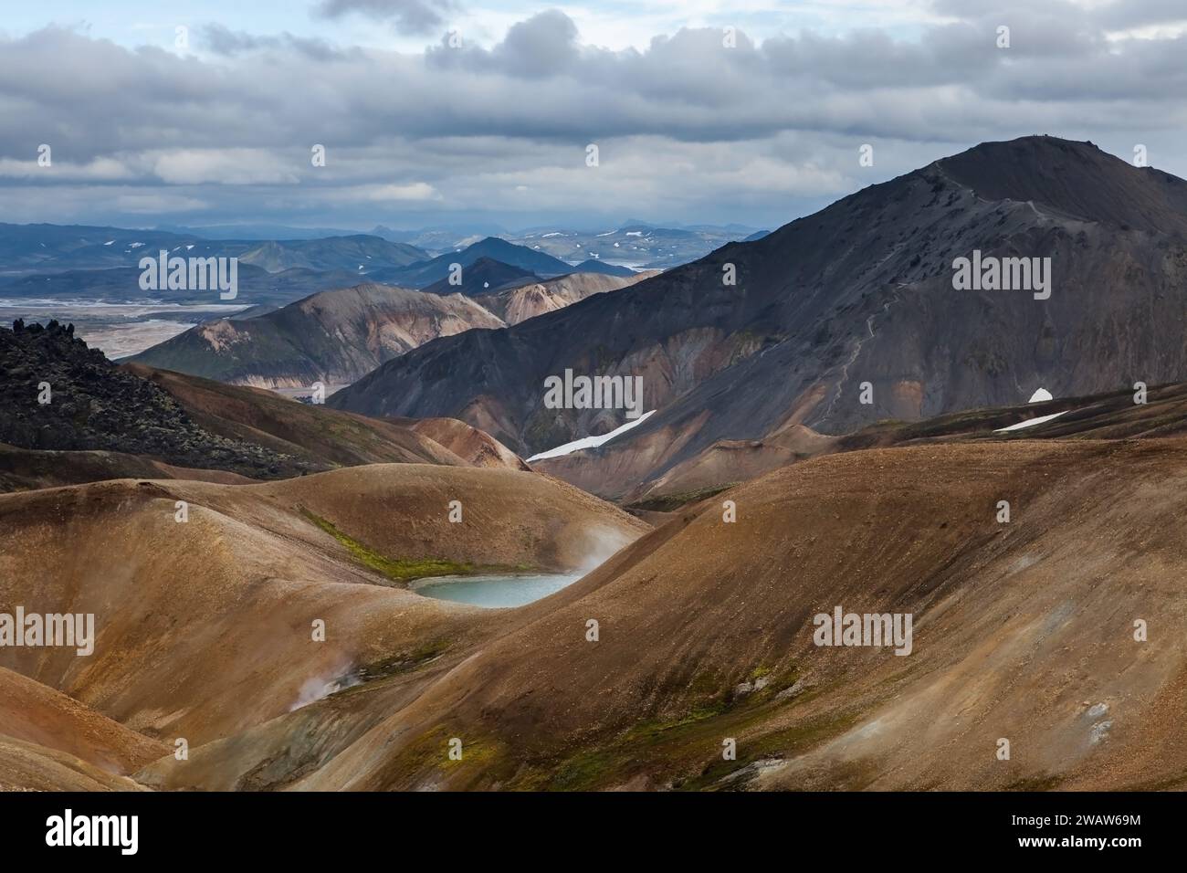 Dramatic Iceland scenery with colorful rhyolite mountains, heavy gray ...
