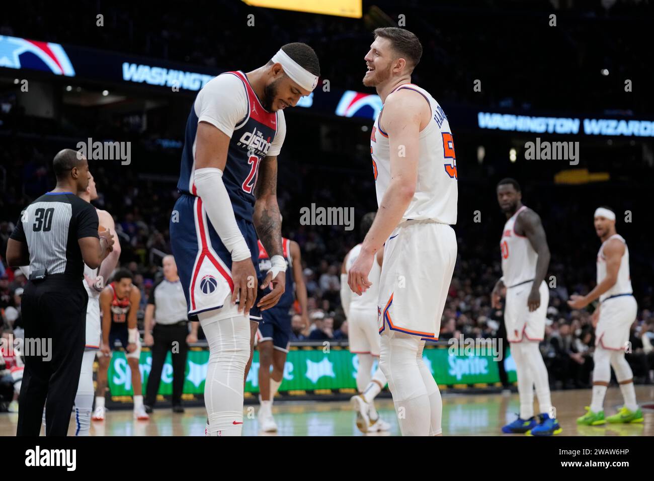 Washington Wizards center Daniel Gafford, center left, and New York ...