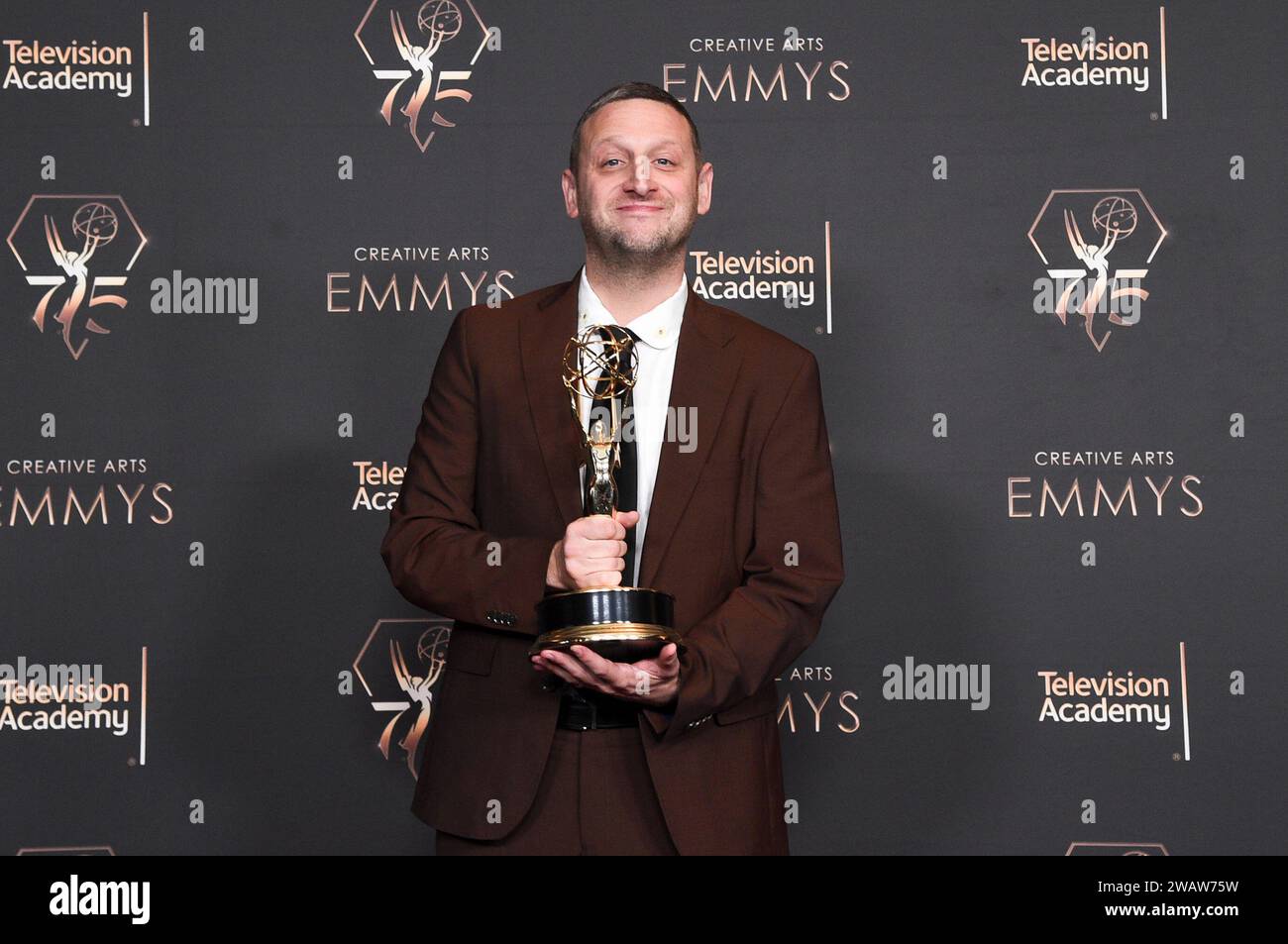 Tim Robinson poses with the award for outstanding actor in a short form ...