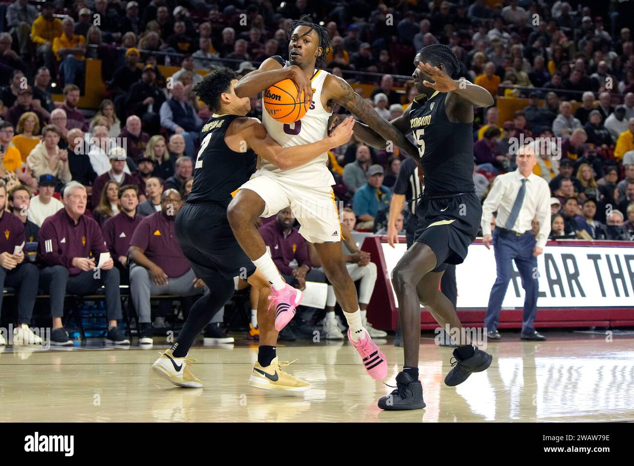 Arizona State guard Jamiya Neal (5) drives between Colorado guard KJ ...