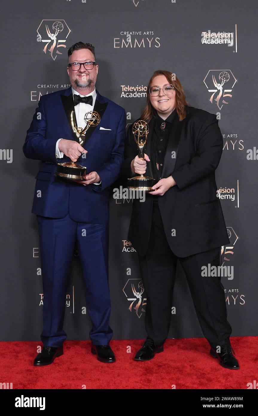 Timothy A. Good, left, and Emily Mendez pose in the press room with the ...