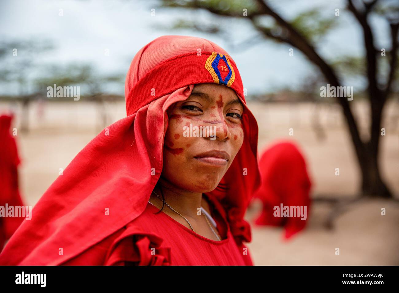 A Wayuu girl wearing a traditional cloth poses for a photo as she takes ...