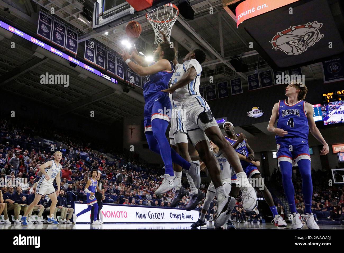 Gonzaga forward Anton Watson, center left, shoots while pressured by ...