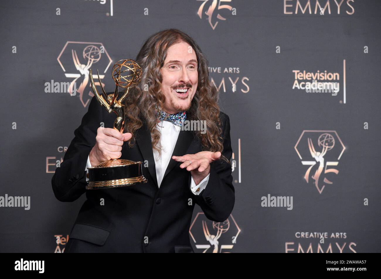 "Weird Al" Yankovic poses in the press room with the award for ...