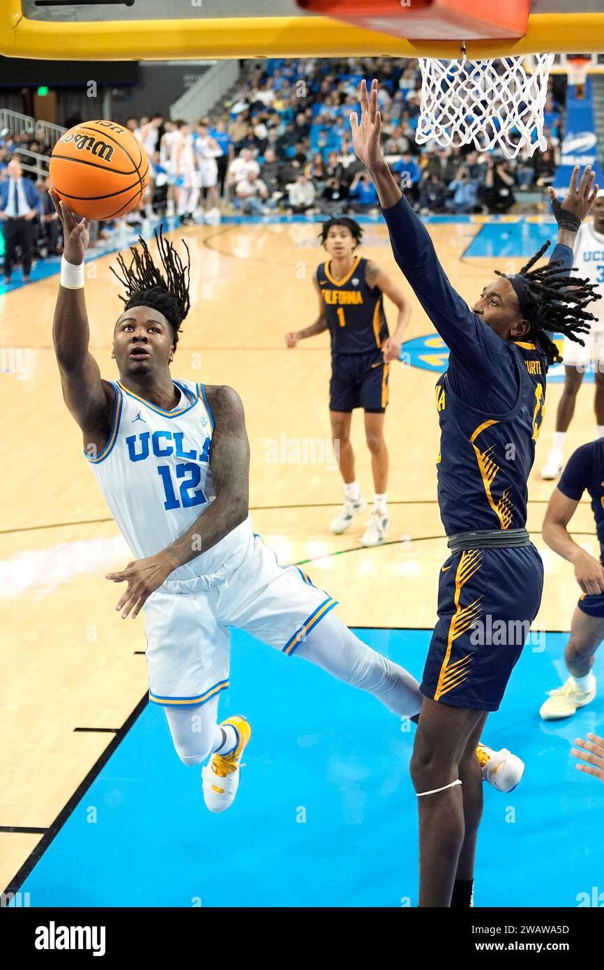 UCLA guard Sebastian Mack, left, shoots as California forward Devin ...