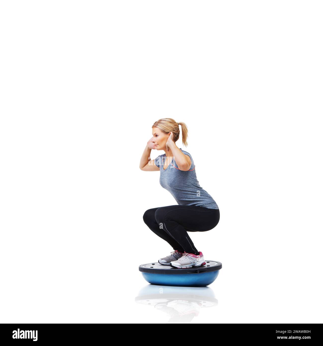 Woman, squat and exercise on bosu ball for workout, training or ...