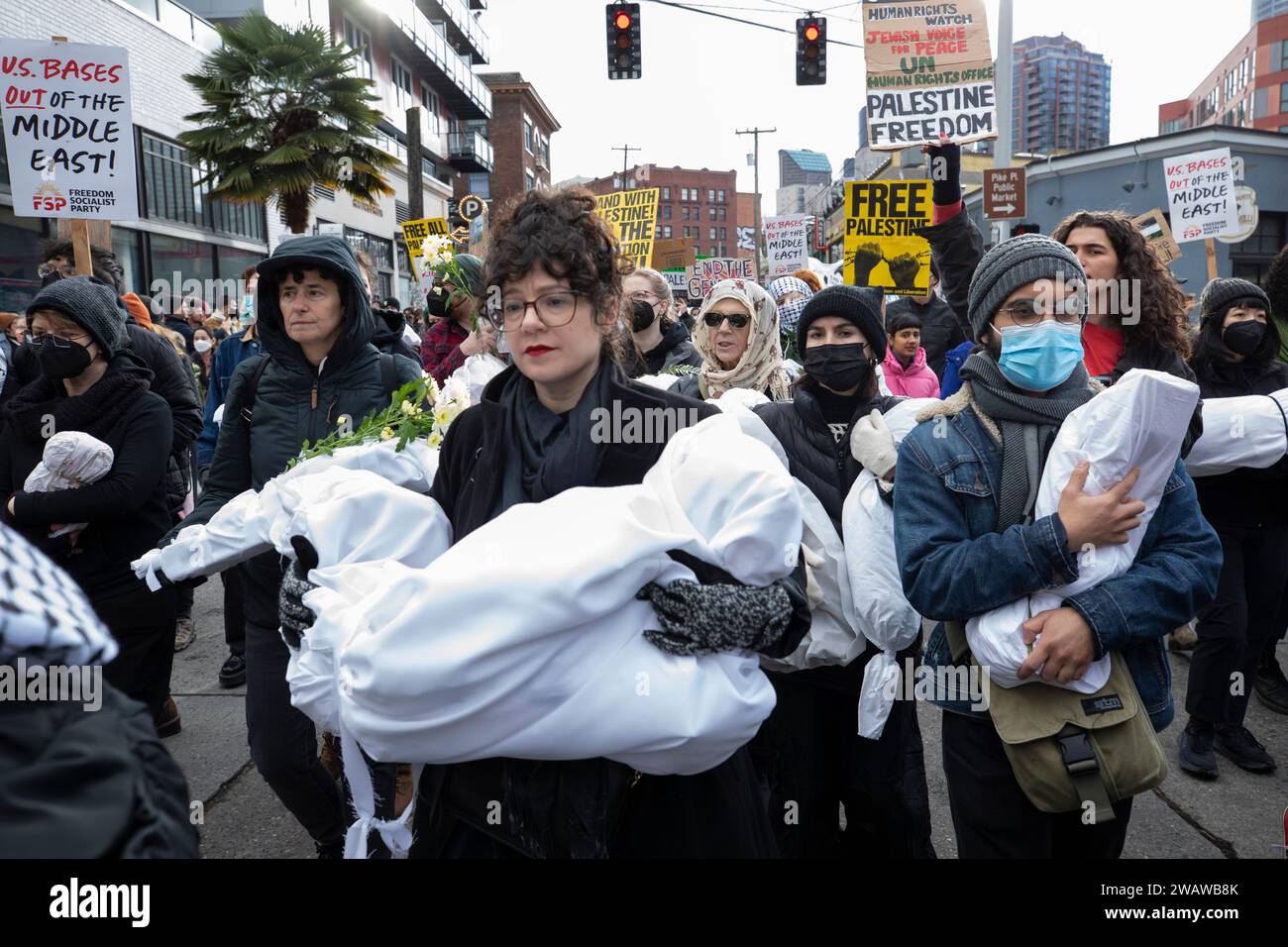 Seattle, Washington, USA. 6th January, 2024. Protestors hold shrouded ...